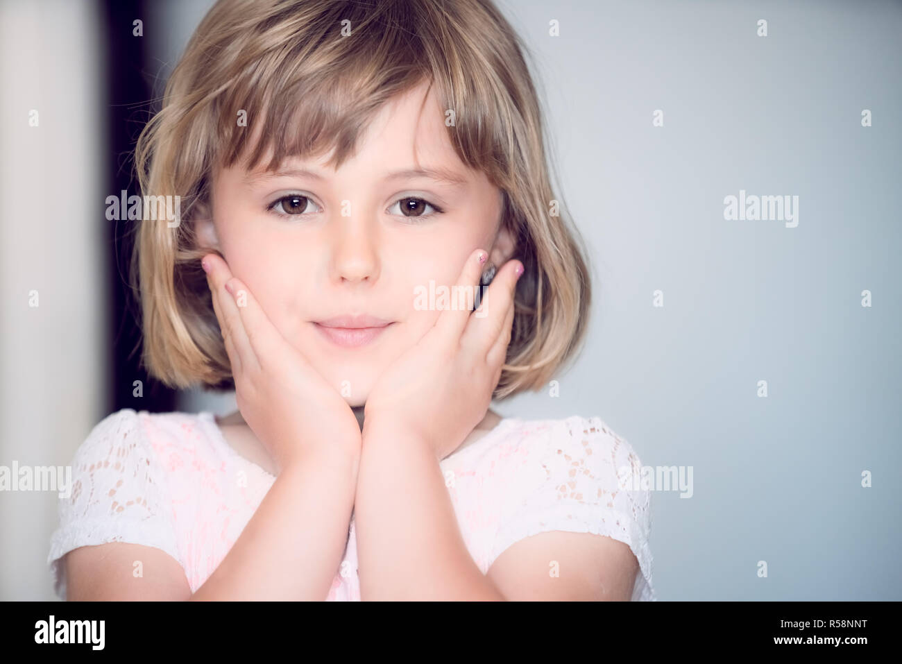 Portrait of a cute concerned Caucasian little girl Stock Photo - Alamy