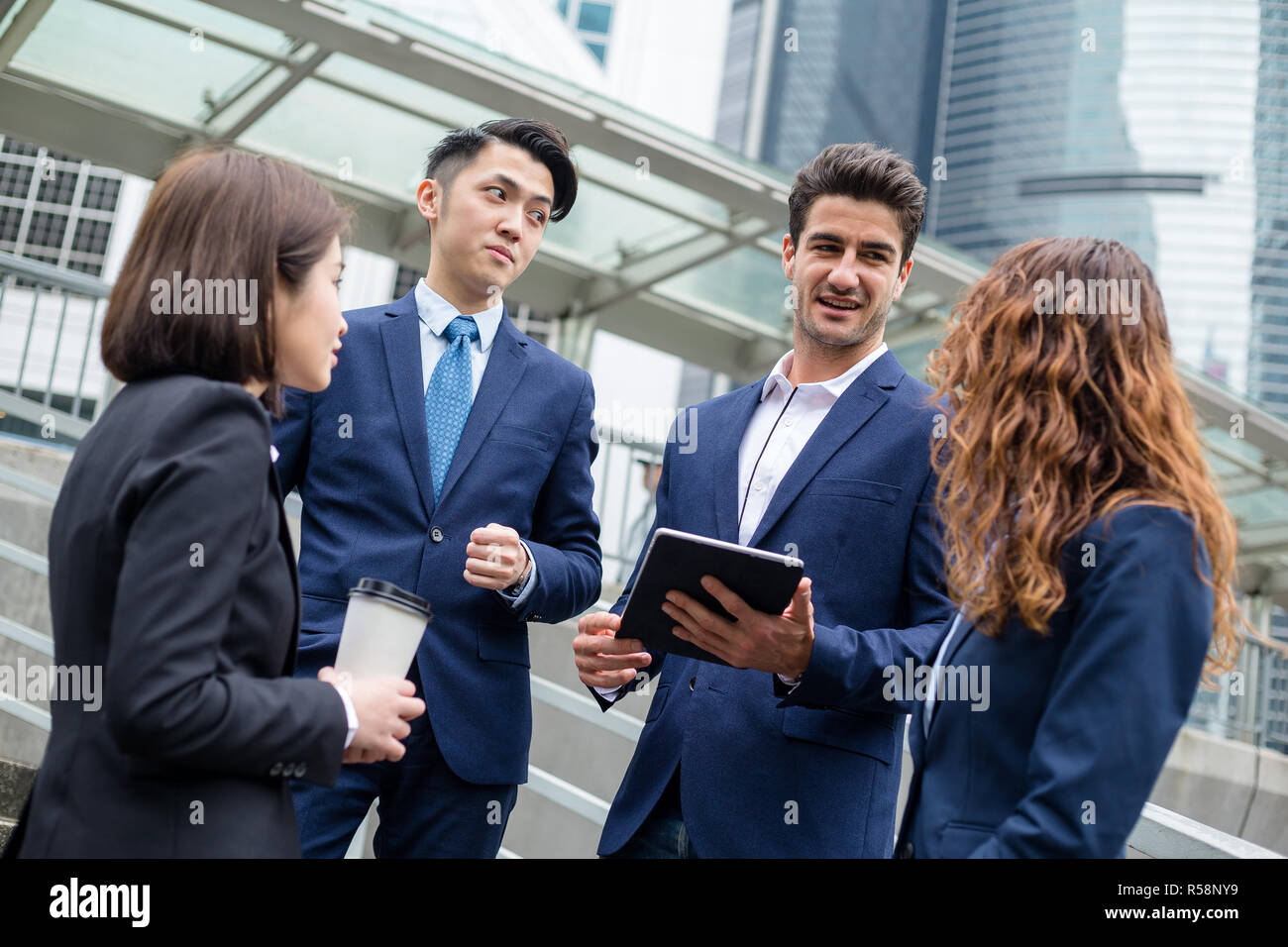 Business team talking at outdoor Stock Photo - Alamy