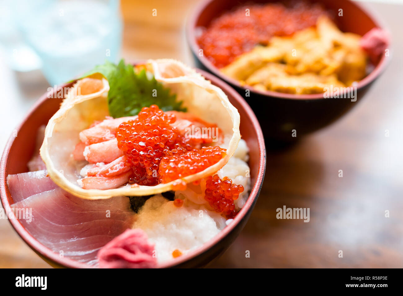 Seafood rice bowl in Japanese restaurant Stock Photo - Alamy