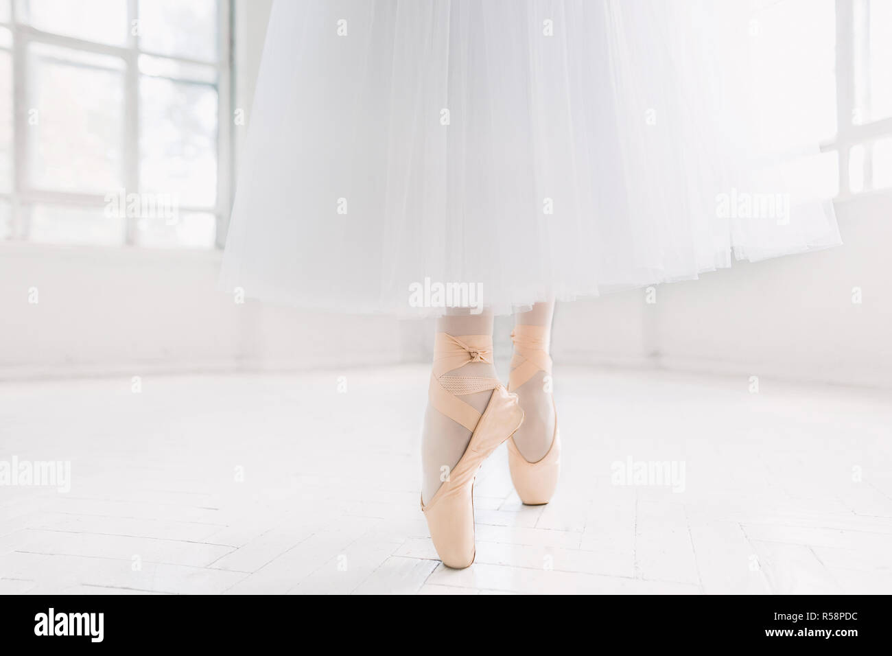 The Closeup Feet Of Young Ballerina In Pointe Shoes