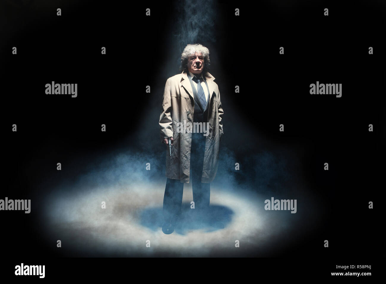 Senior police agent with a gun on dark smoke background Stock Photo - Alamy