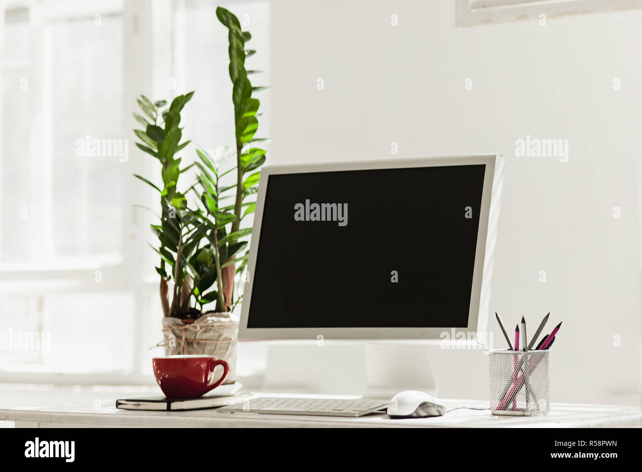 Stylish workspace with computer on home or studio Stock Photo - Alamy