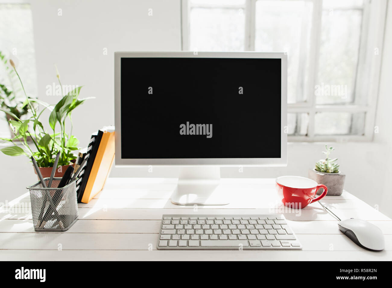 Stylish workspace with computer on home or studio Stock Photo - Alamy