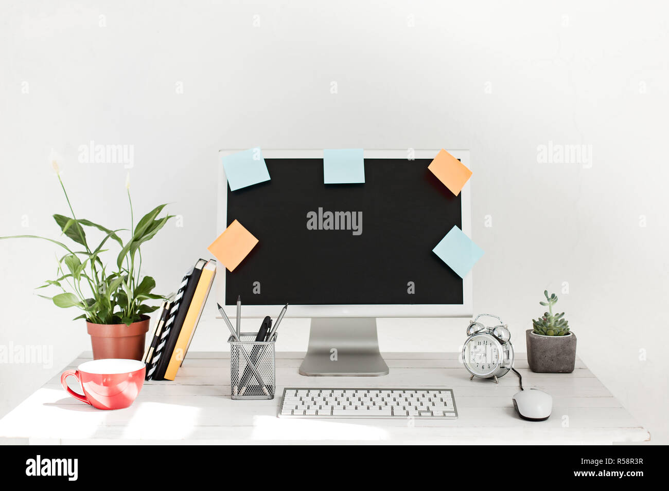 Stylish workspace with computer on home or studio Stock Photo - Alamy