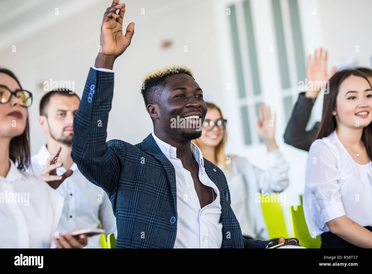 Students audience raising hand hi-res stock photography and images - Alamy