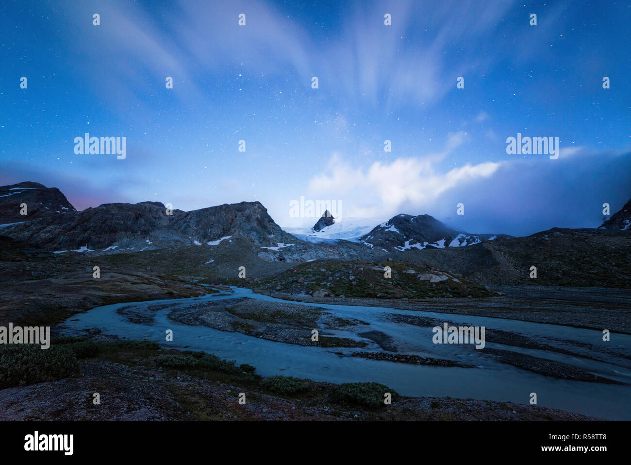 Starry sky over Testa del Rutor with glacier river, Aosta Valley, Italy ...