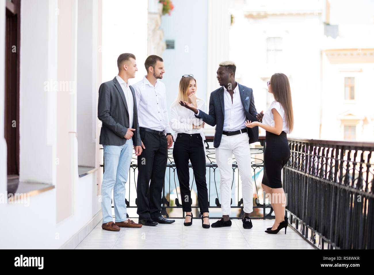 Group of business people talking outdoor in an urban setting Stock ...