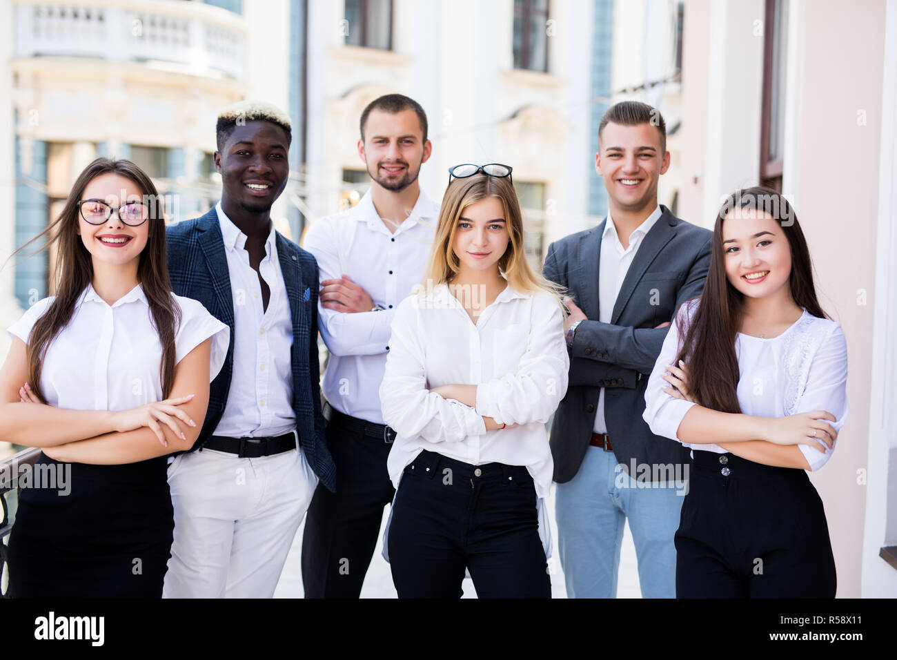 Portrait Of mixed race Business Team Outside of Office Stock Photo - Alamy