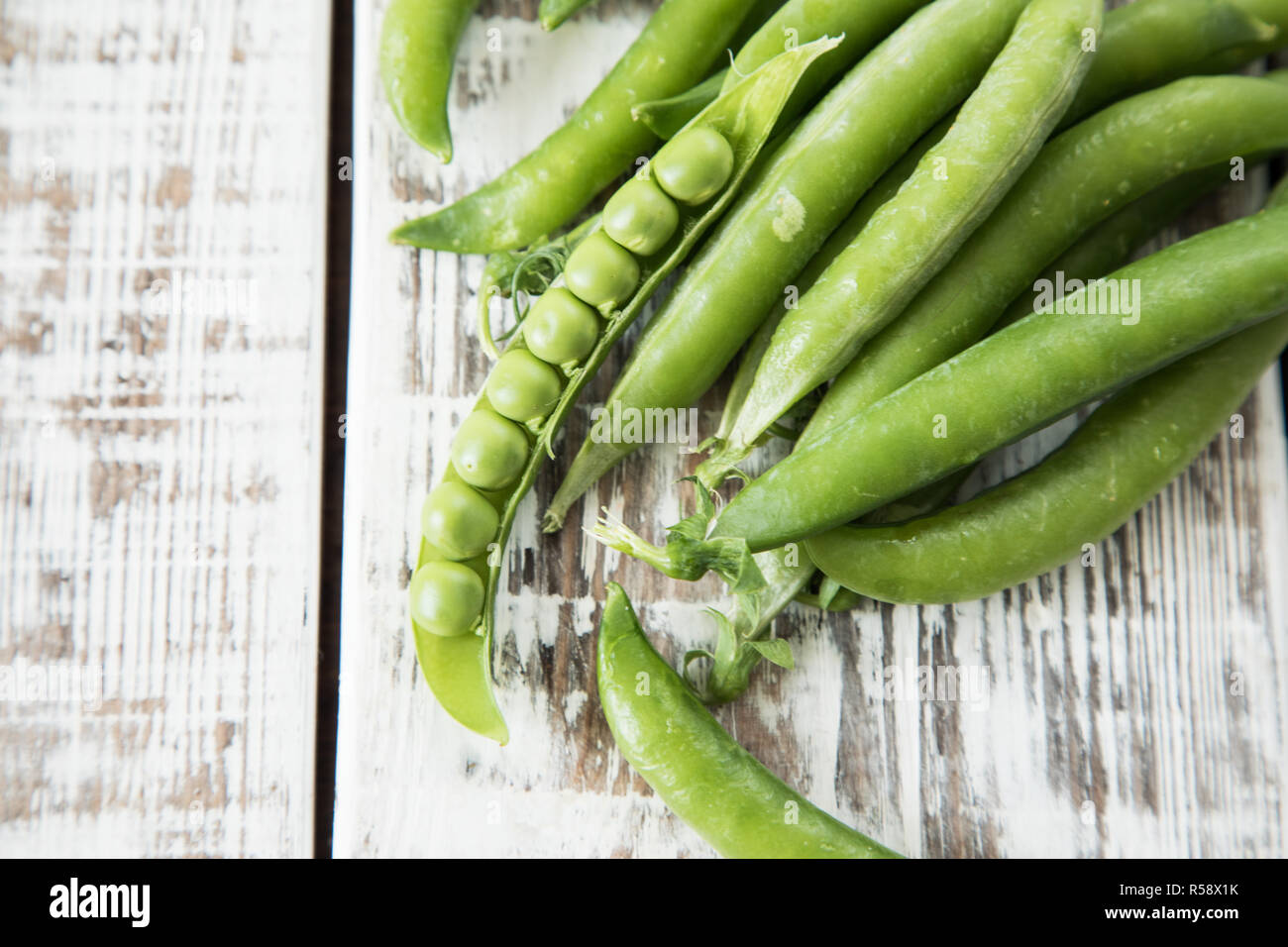 green pea pod, green peas. Vegetable background Stock Photo - Alamy