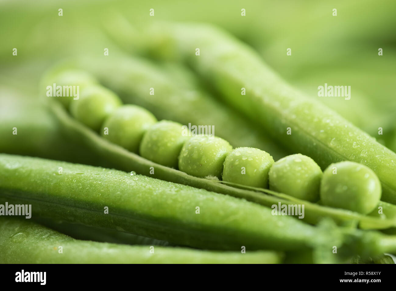 green pea pod, green peas. Vegetable background Stock Photo - Alamy