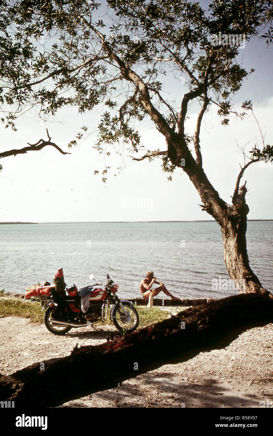 Vacationer From Ohio Relaxes near His Motorcycle During Sightseeing ...