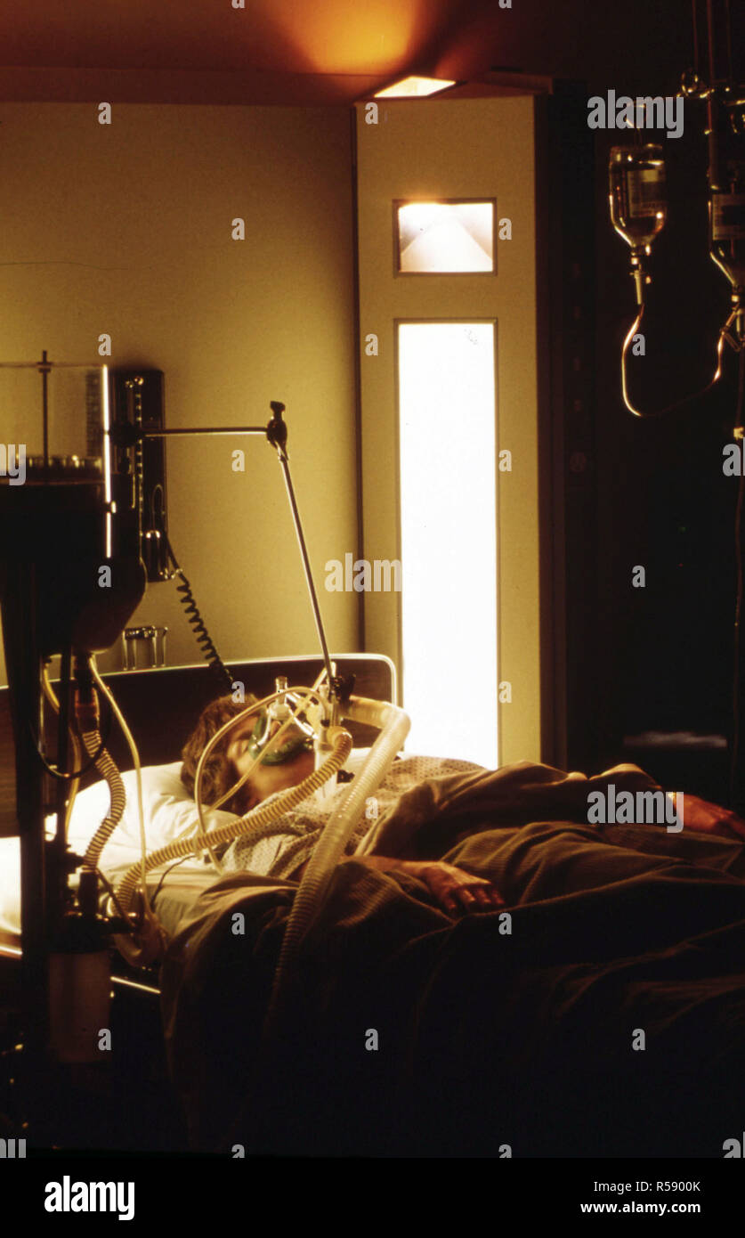 Man in intensive care unit in hospital ca. 1975 Stock Photo - Alamy