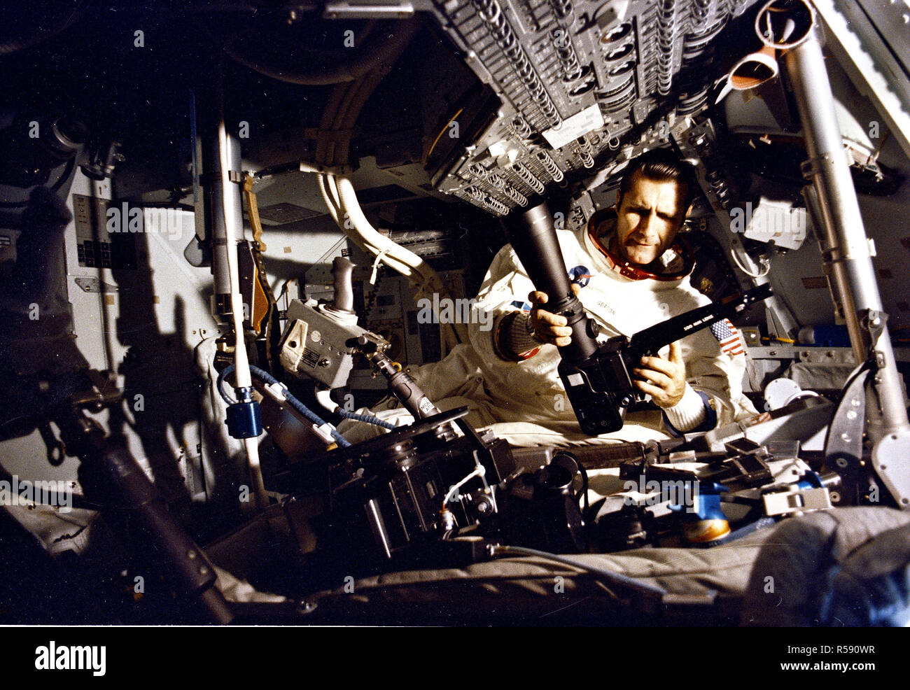 This is a view of astronaut Richard F. Gordon attaching a high ...