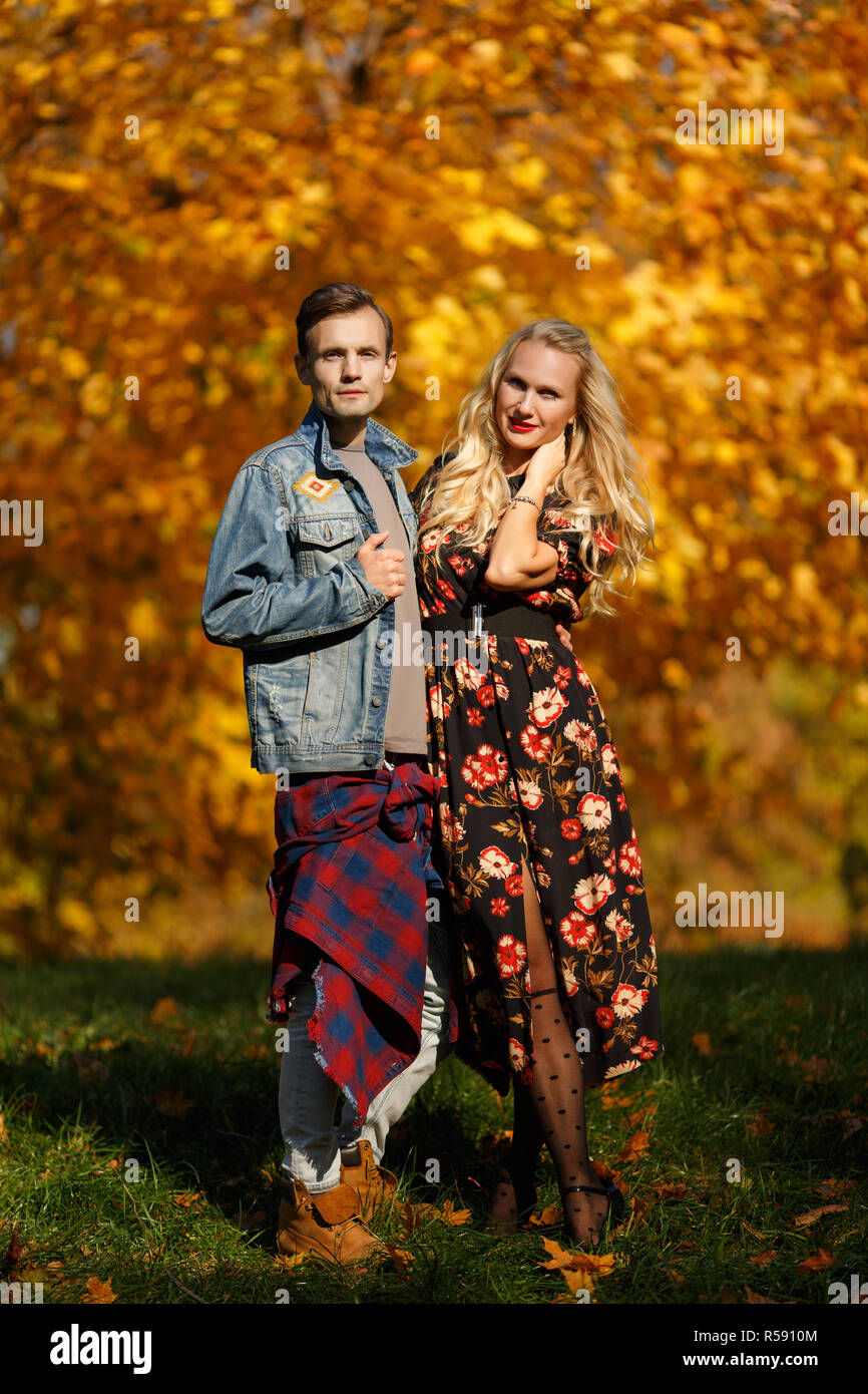 Photo of young couple standing in autumn forest Stock Photo - Alamy Photo of young couple standing in autumn forest Stock Photo - Alamy