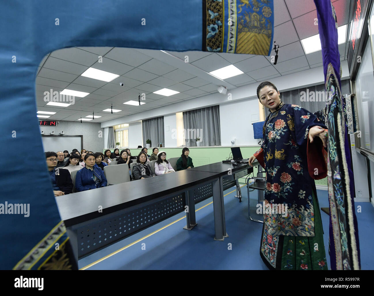 Beijing, China. 30th Nov, 2018. Designer Bi Hong introduces a classical ...