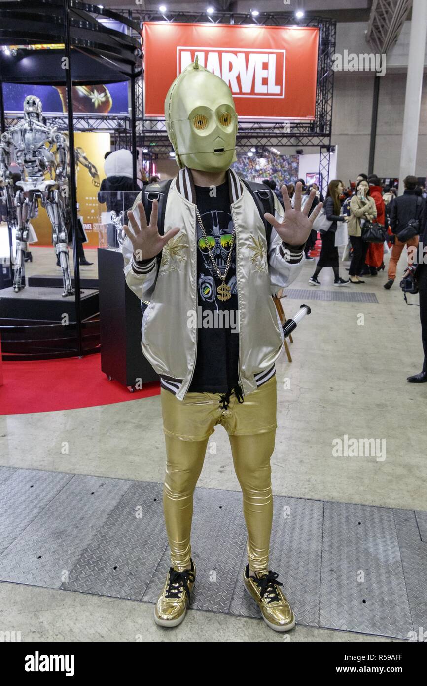 Chiba, Japan. 30th Nov, 2018. A cosplayer poses for a photograph during ...