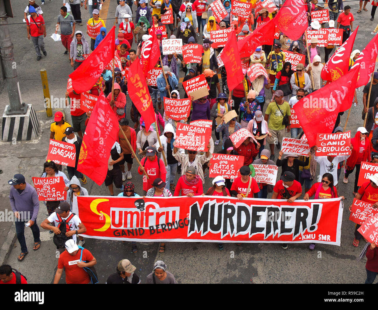 Manila, Philippines. 20th Feb, 2012. Protesters are seen holding a ...