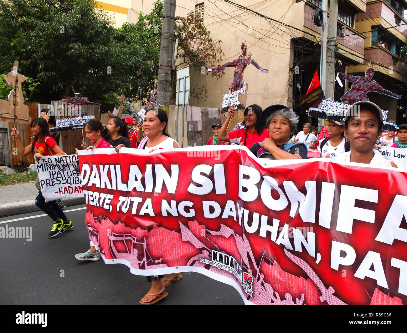 Manila, Philippines. 20th Feb, 2012. Protesters are seen holding a ...