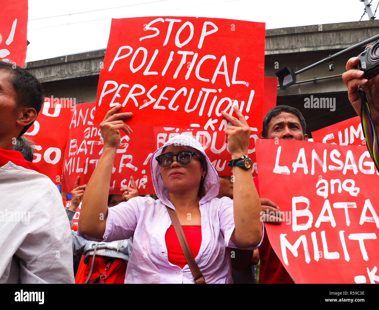 Manila, Philippines. 20th Feb, 2012. A protester seen holding a placard ...