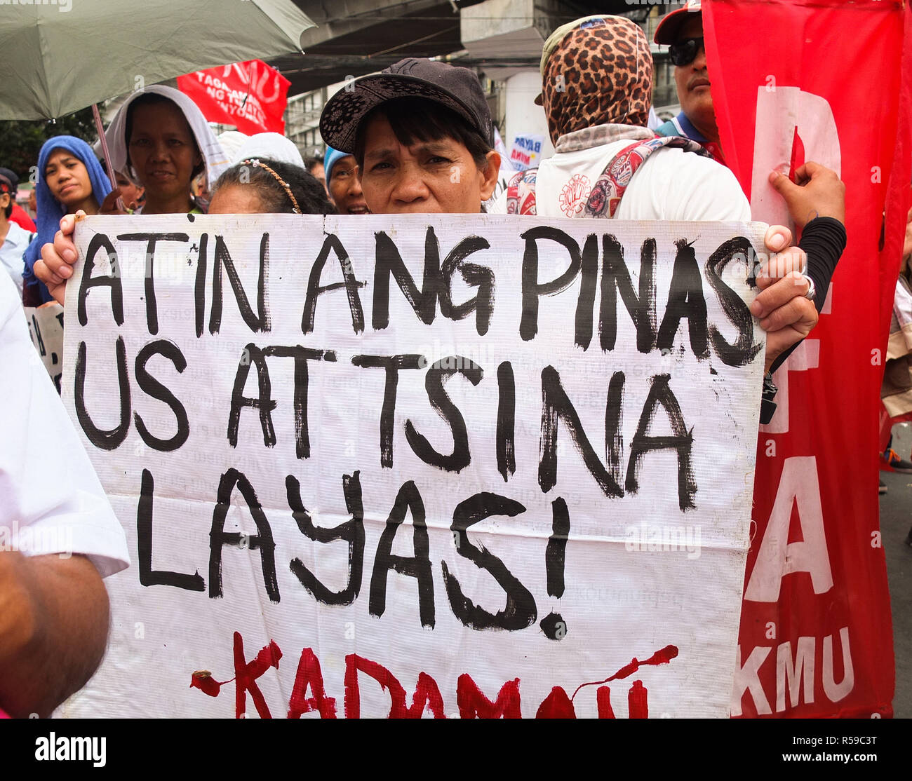 Manila, Philippines. 20th Feb, 2012. A protester seen holding a placard ...