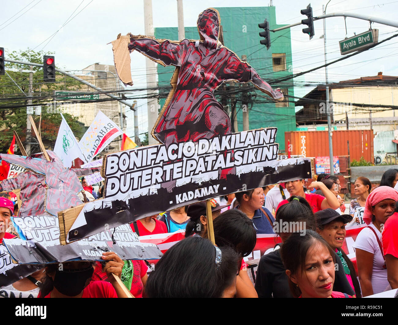 Manila, Philippines. 20th Feb, 2012. Protesters are seen holding a ...