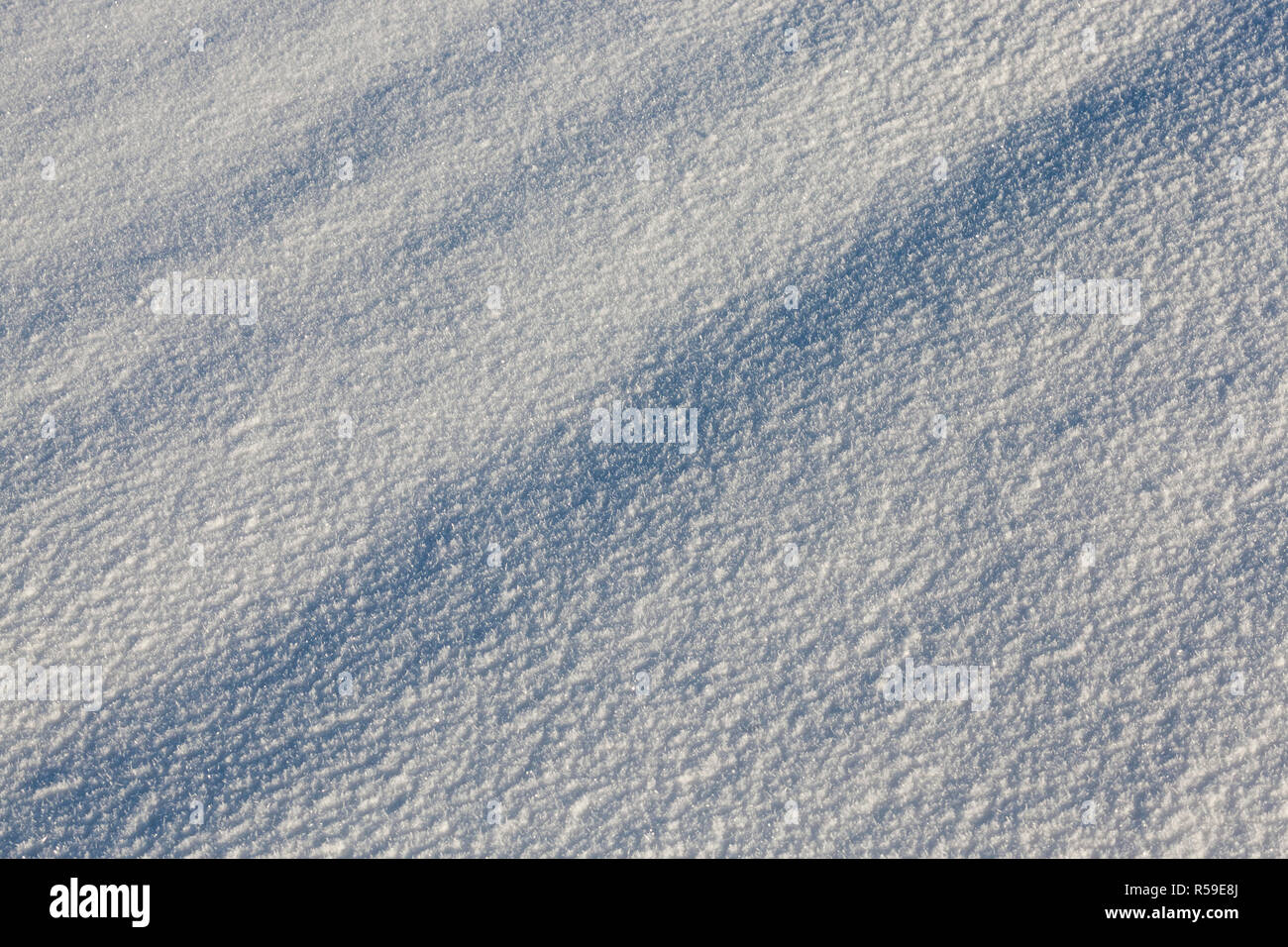 solid snow falling on the ground, Photo of a closeup of snow drifts in ...