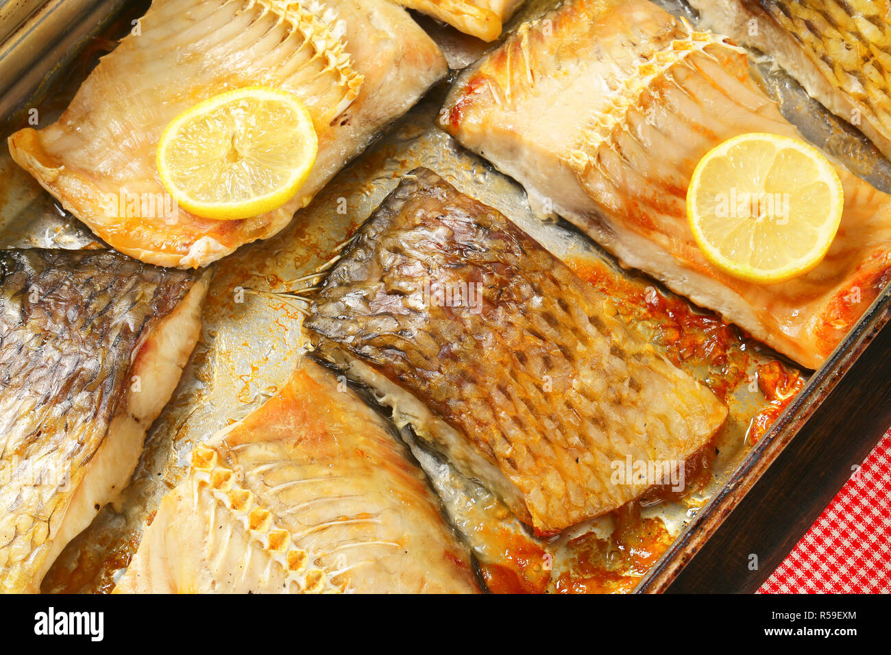 Oven baked carp fillets Stock Photo - Alamy