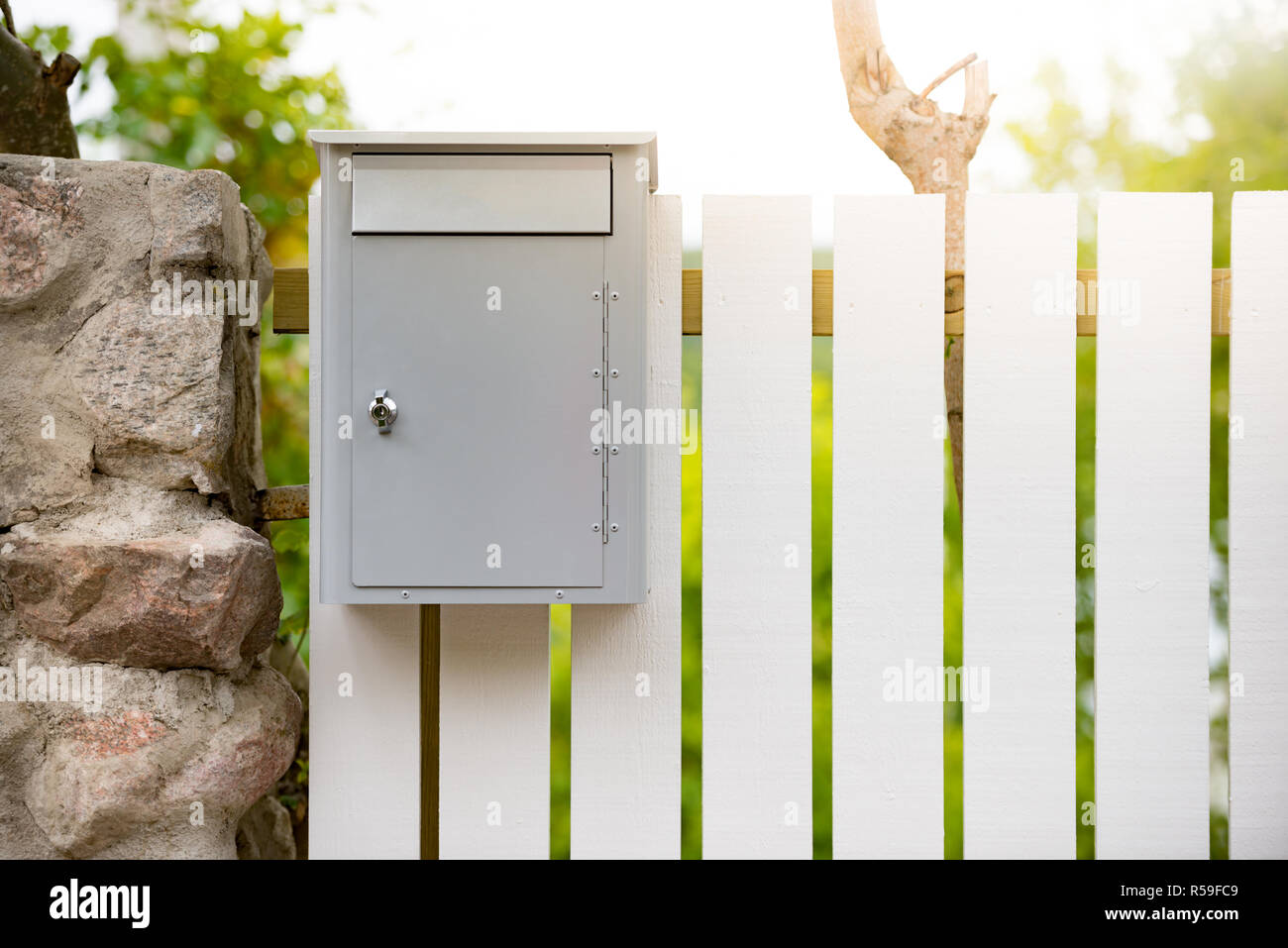 Post box on wooden fence. Sweden, Europe Stock Photo - Alamy