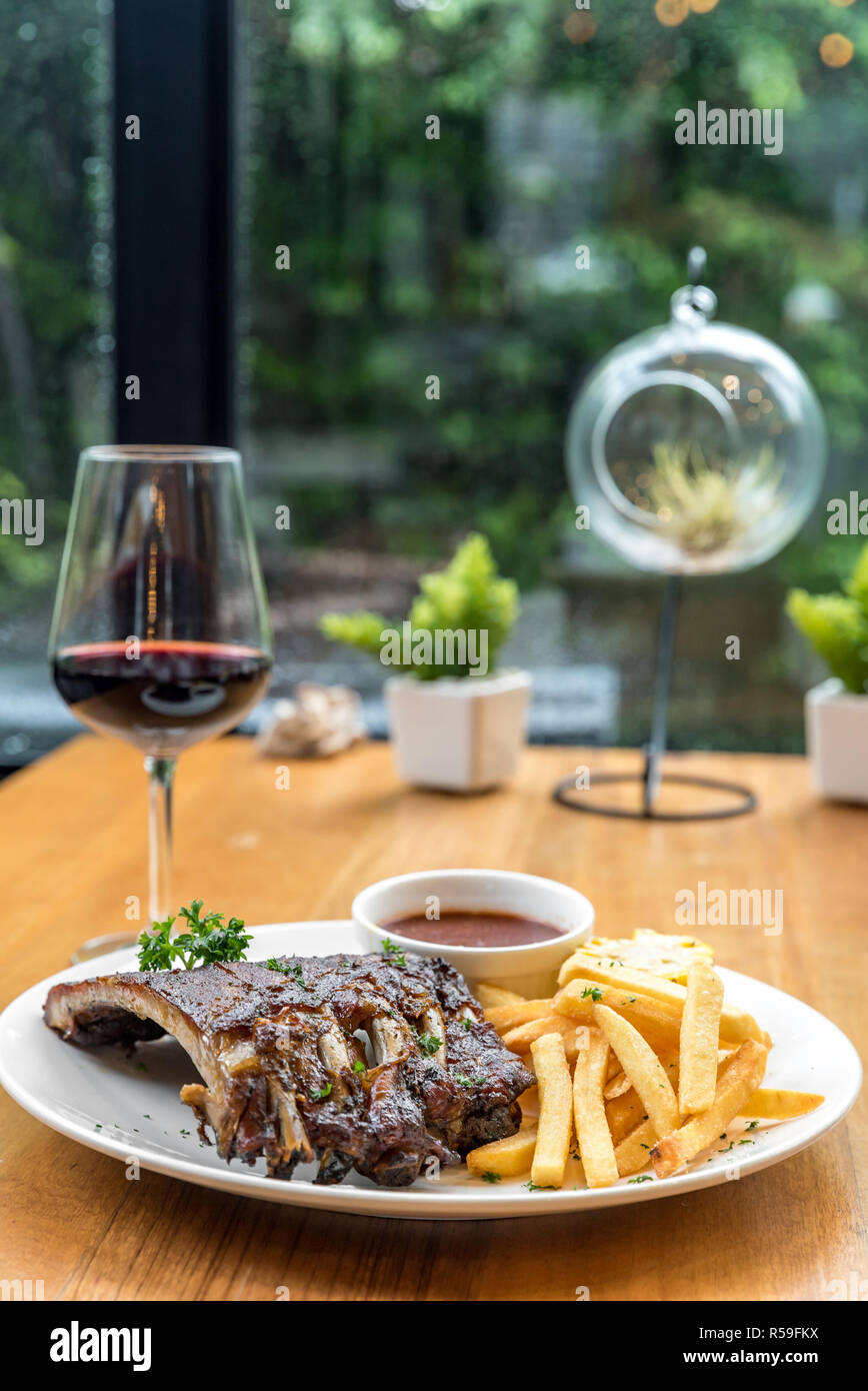Grilled Pork rib dining table Stock Photo - Alamy