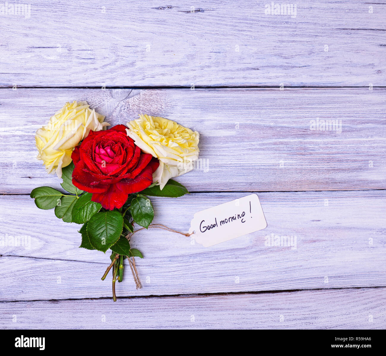 roses and a paper tag with an inscription good morning Stock Photo - Alamy