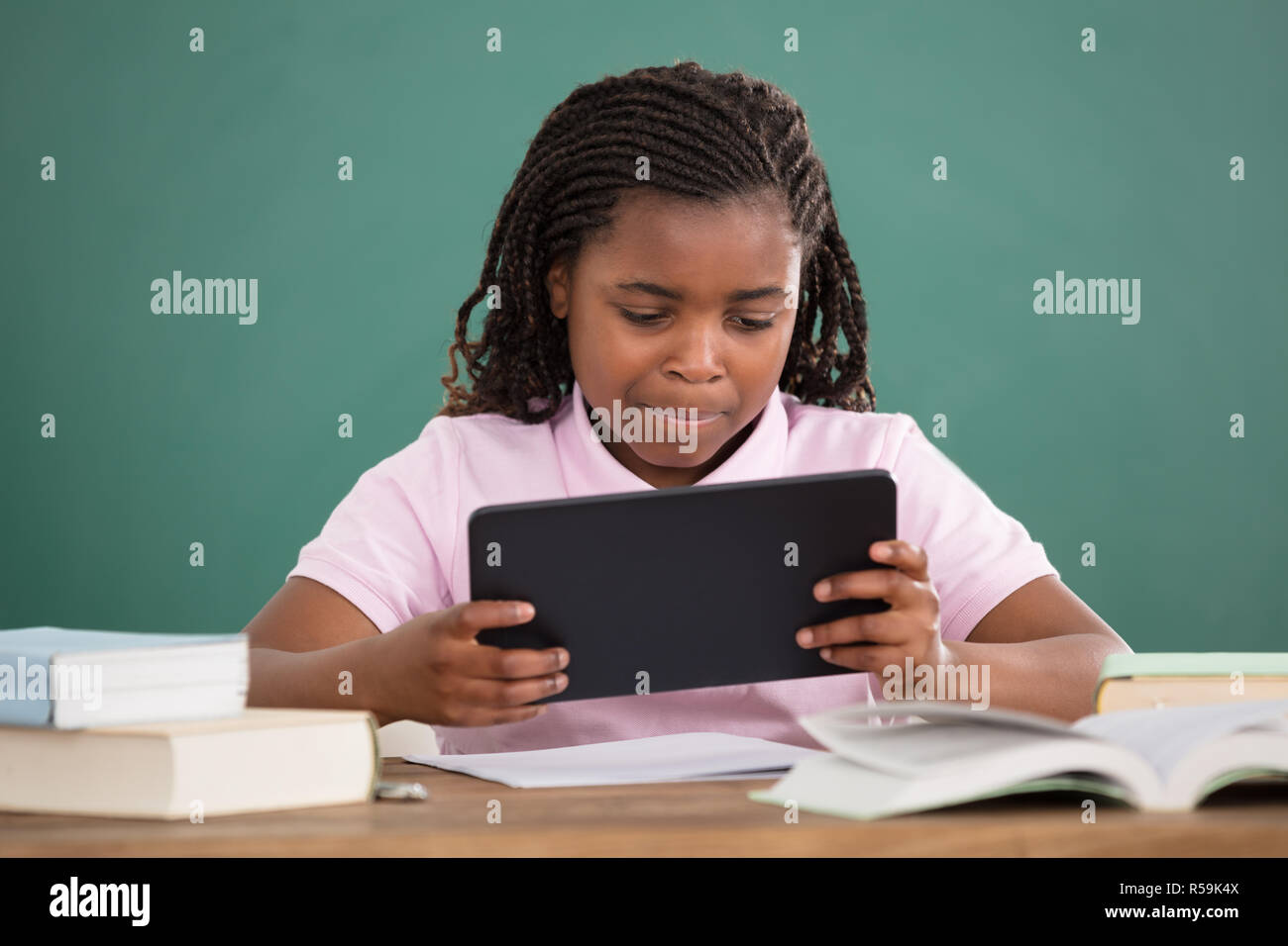 Schoolgirl Using Digital Tablet Stock Photo - Alamy