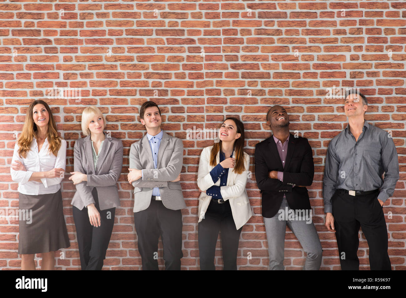 Group Of Businesspeople Looking Up Stock Photo - Alamy
