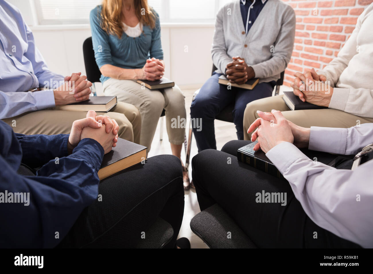 Bible group praying together High Resolution Stock Photography and ...