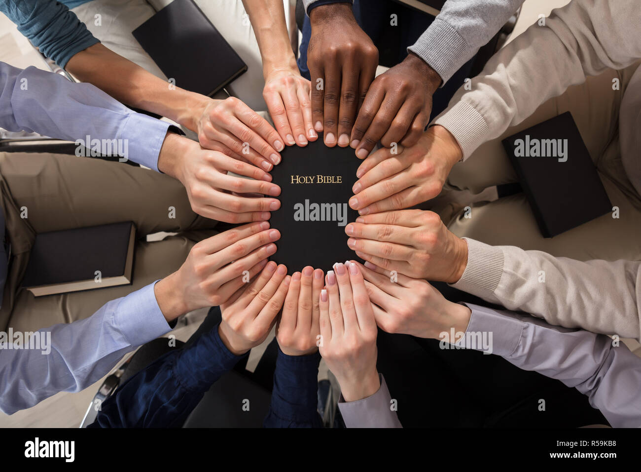 Hands Holding Holy Bible Stock Photo - Alamy