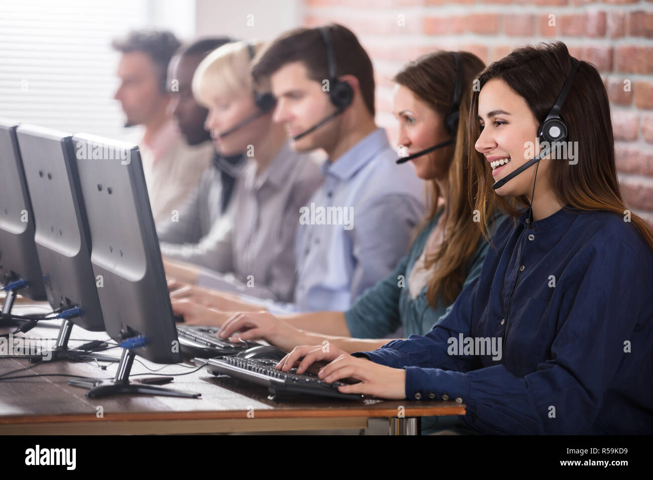Female Customer Services Agent In Call Center Stock Photo - Alamy