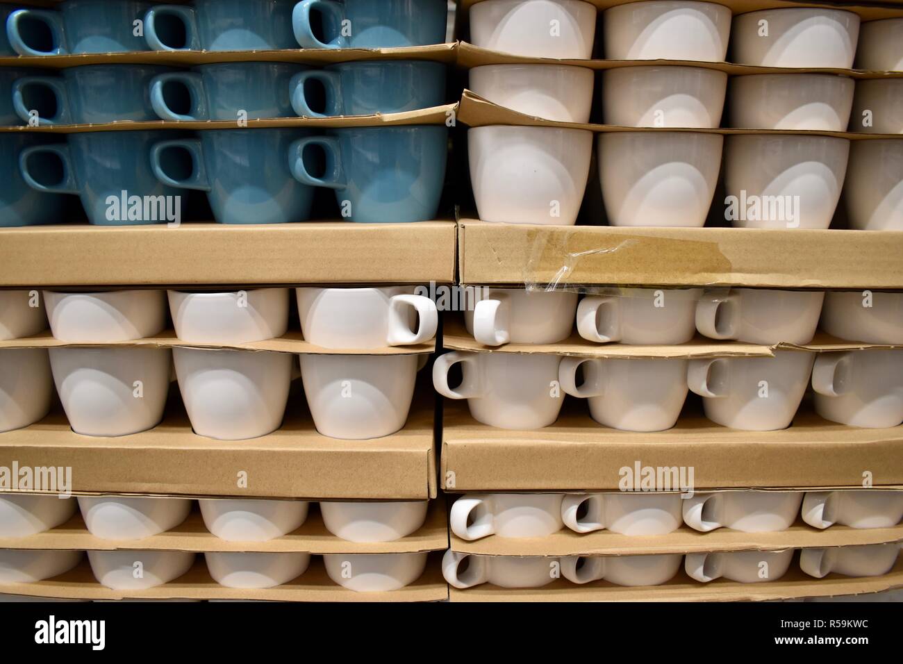 Stack of white and blue cups with cardbord boxes between Stock Photo ...