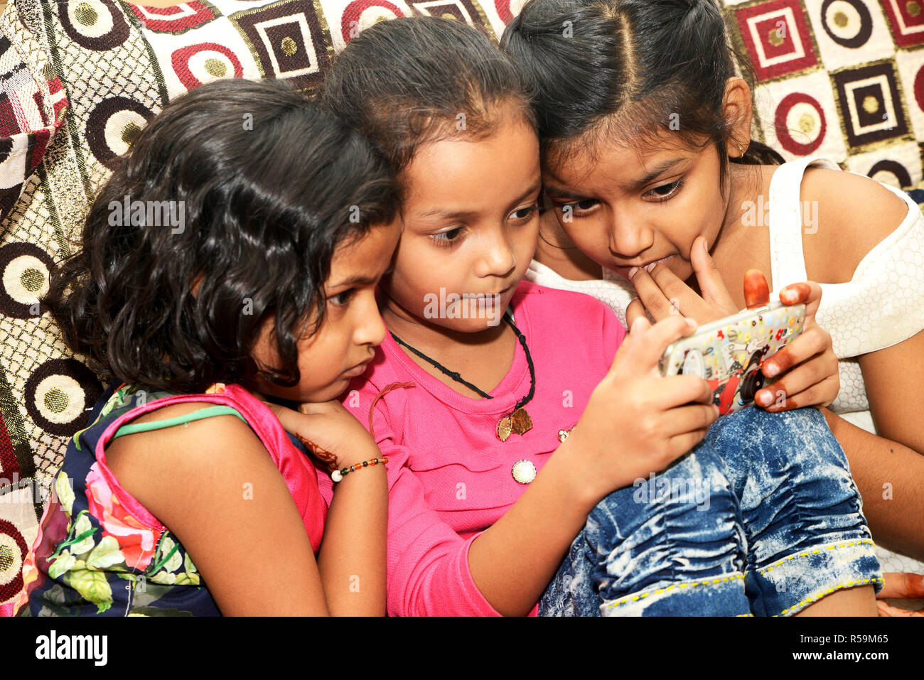 Group of children using smart phone Stock Photo - Alamy