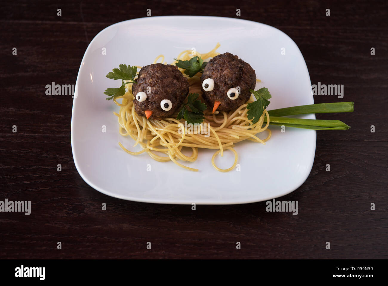 Funny meatballs with pasta Stock Photo - Alamy