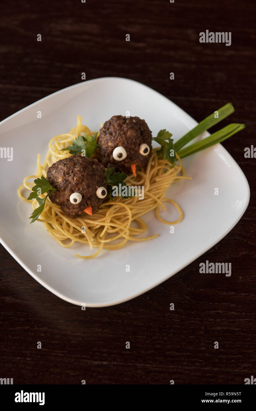 Funny meatballs with pasta Stock Photo - Alamy