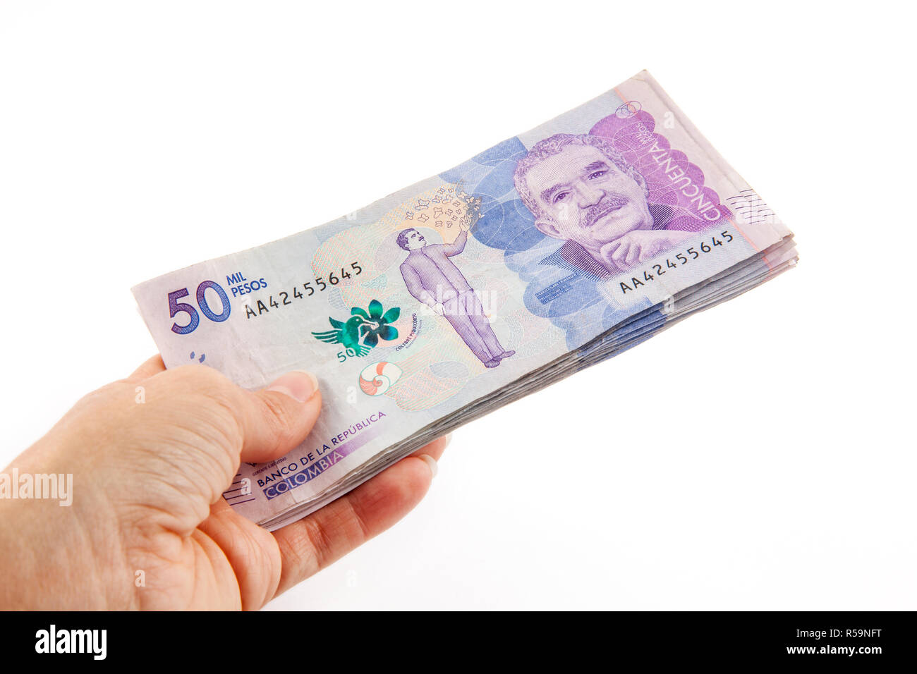 Woman handling money Stock Photo - Alamy