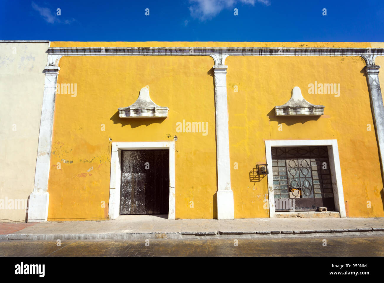 Yellow Colonial Facade Stock Photo - Alamy