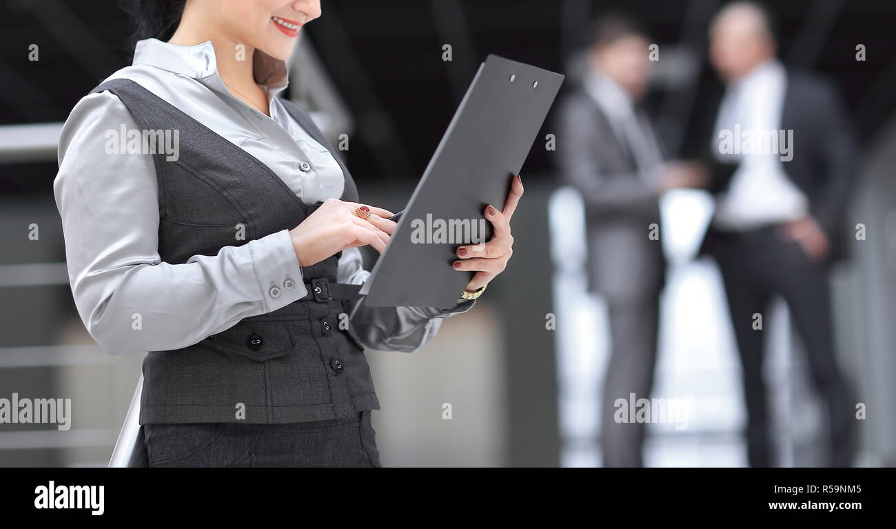 young business woman reading a working paper Stock Photo - Alamy