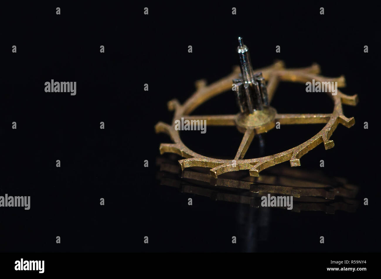 Watch Parts: Vintage Metallic Escape Wheel on Black Background Stock ...