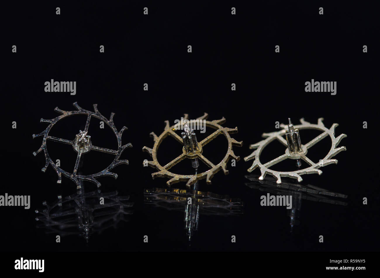 Watch Parts: Three Vintage Metallic Escape Wheels on Black Background ...