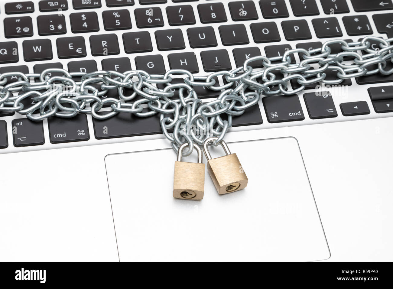 Computer security Secure computer with padlocks and chains. Armored ...