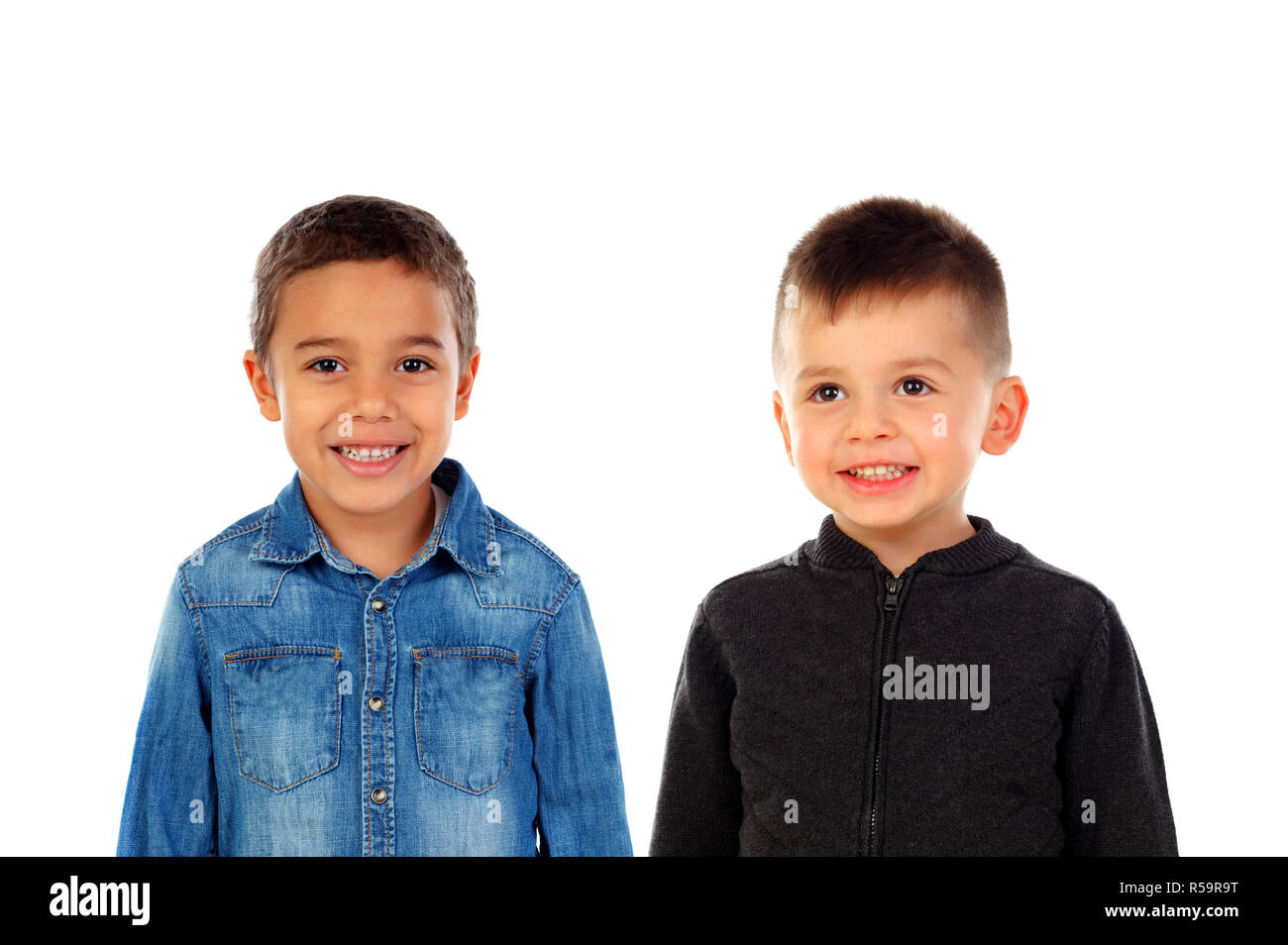 Two children with a beautiful smile isolated on a white background ...