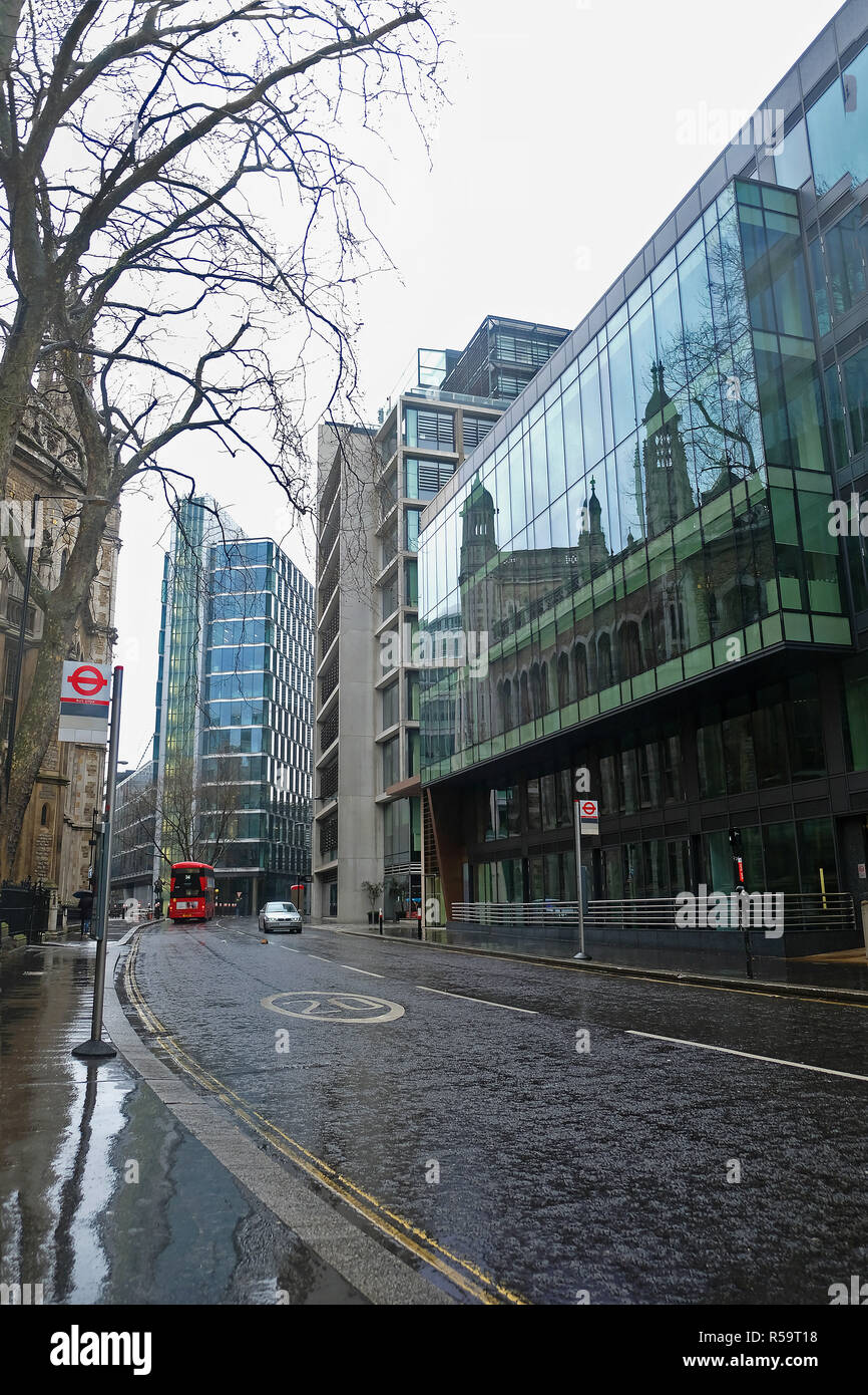 The exterior view on a street in London with bus and reflective ...