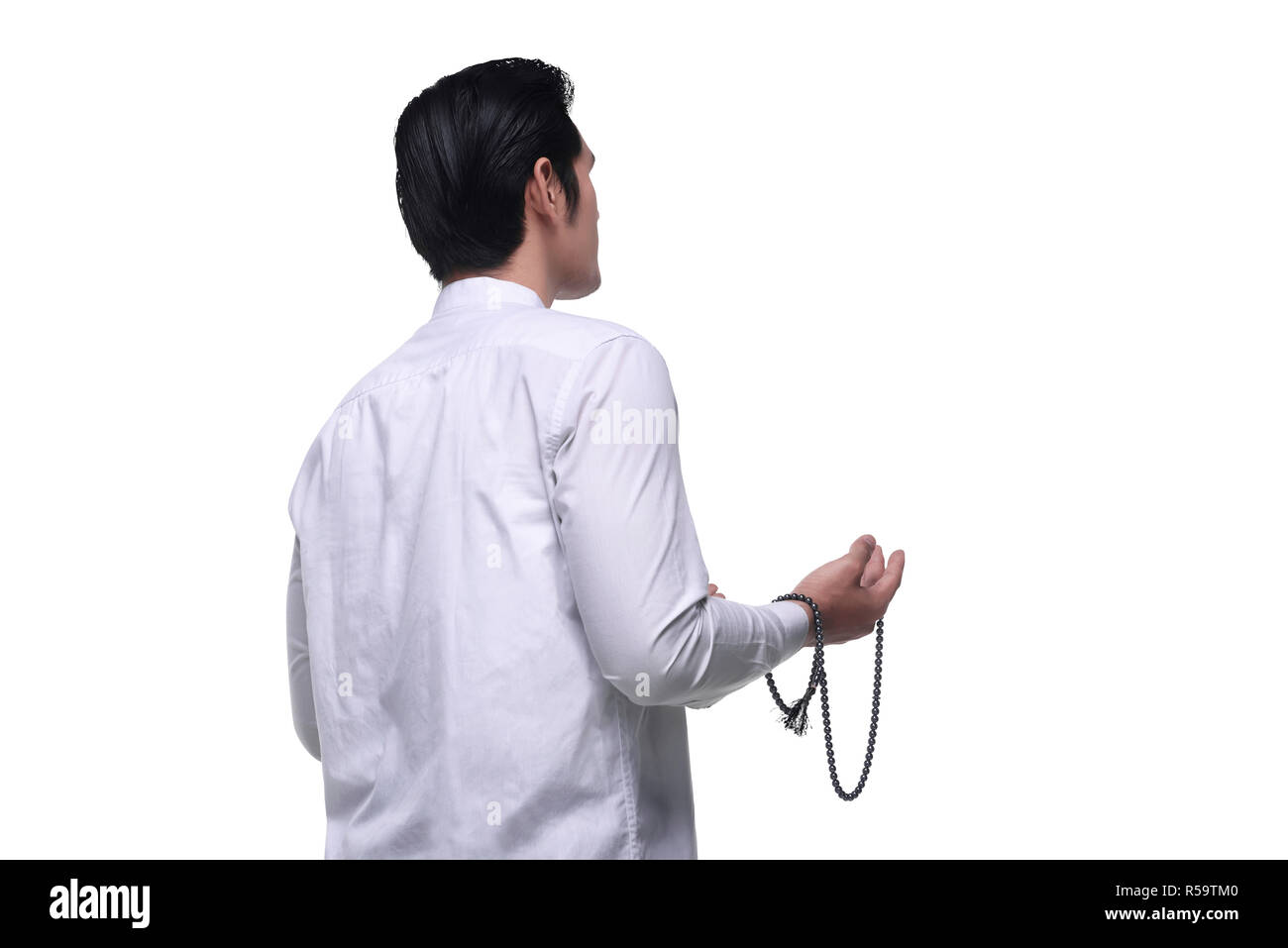 Back view of muslim man with traditional dress praying Stock Photo - Alamy