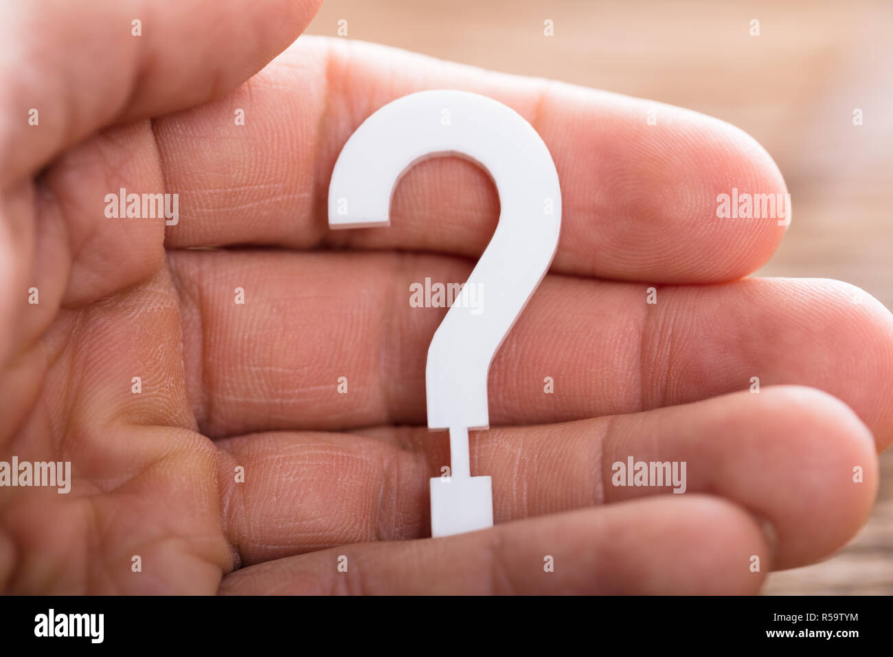 Human Hand Holding Question Mark Sign Stock Photo - Alamy