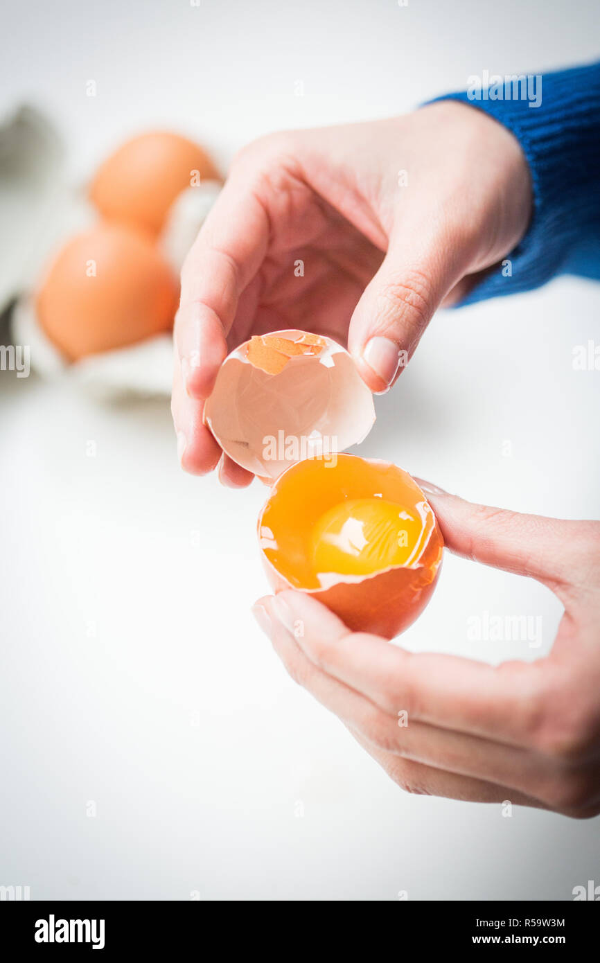 Close up person breaking egg hi-res stock photography and images - Alamy